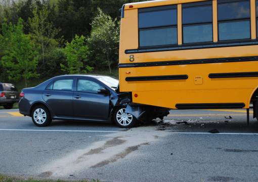 Car hits school bus