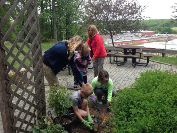 Students plant, learn from garden
