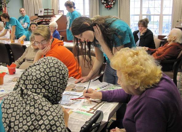 High schoolers do art with senior citizens