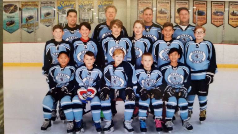 Middle schoolers skate with special needs hockey team